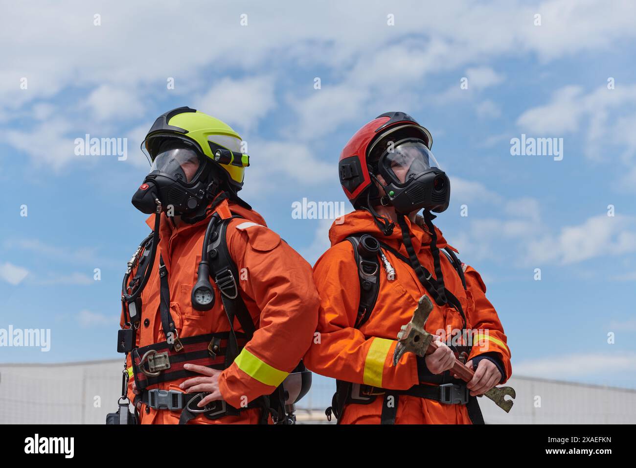 Firefighter Team Training with Various Tools in Professional Gear Stock ...