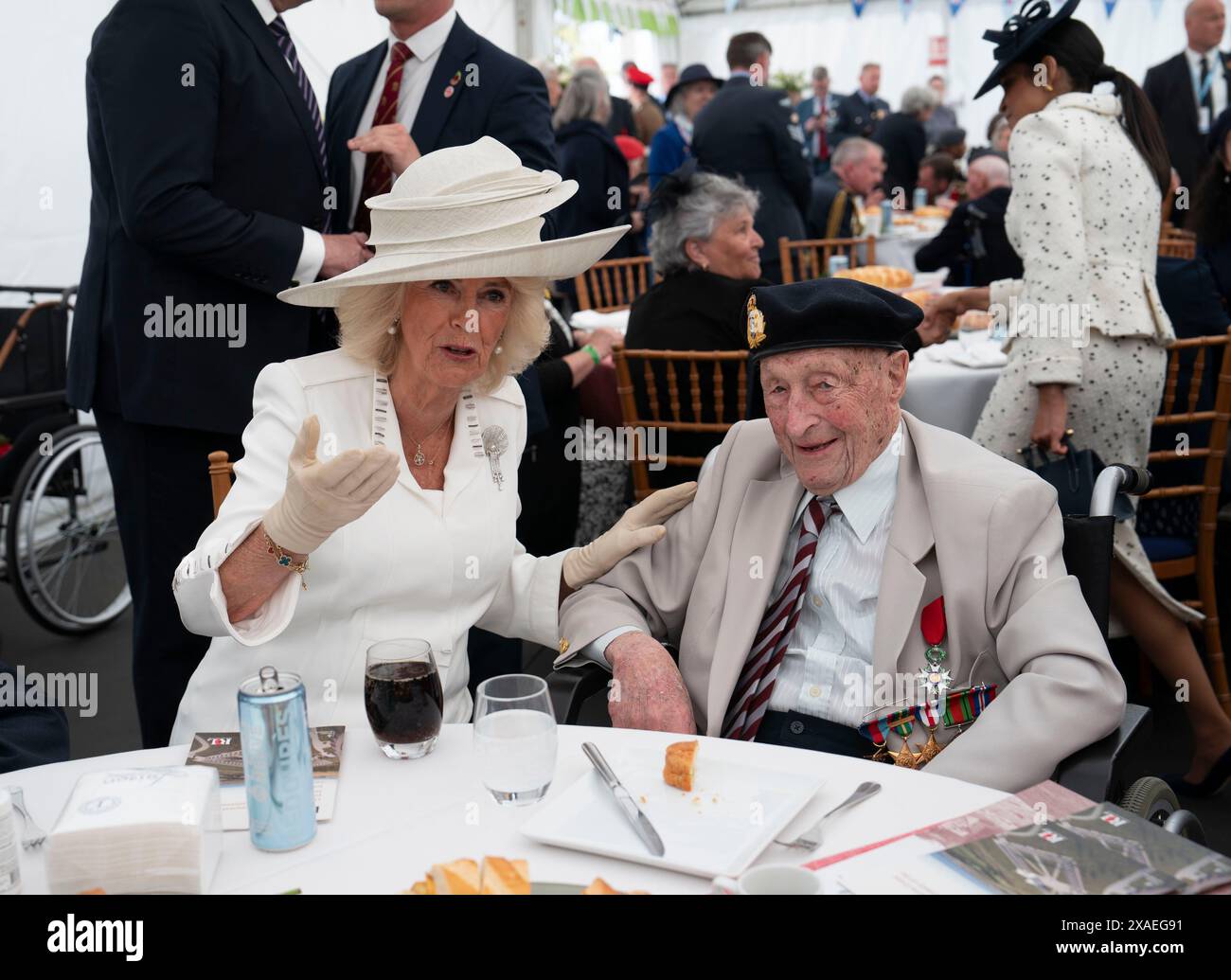 Queen Camilla speaks with veteran Richard Trelease, 94, during a lunch ...