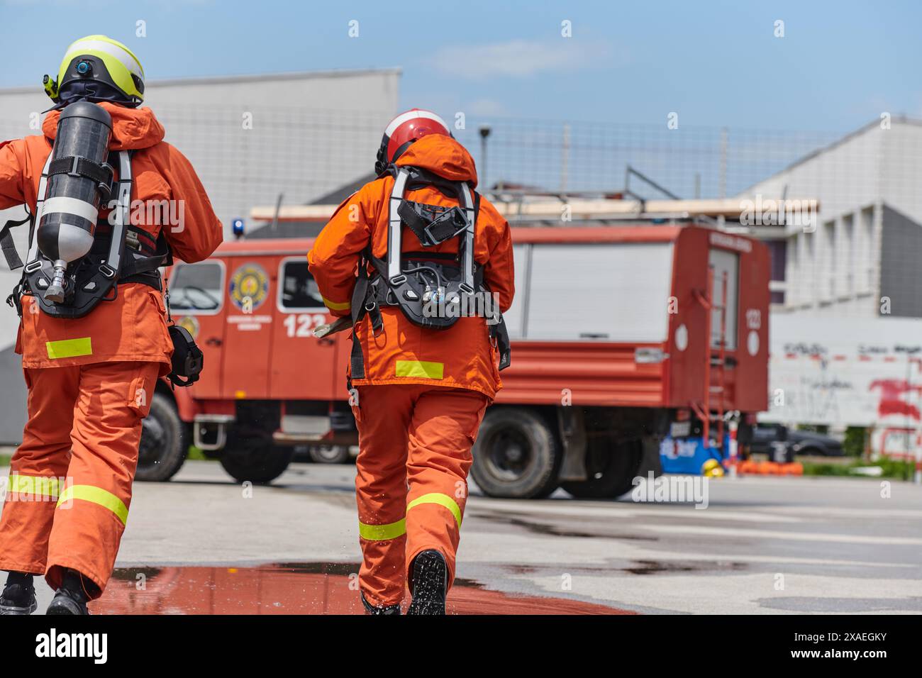 Firefighter Team Training with Various Tools in Professional Gear Stock ...