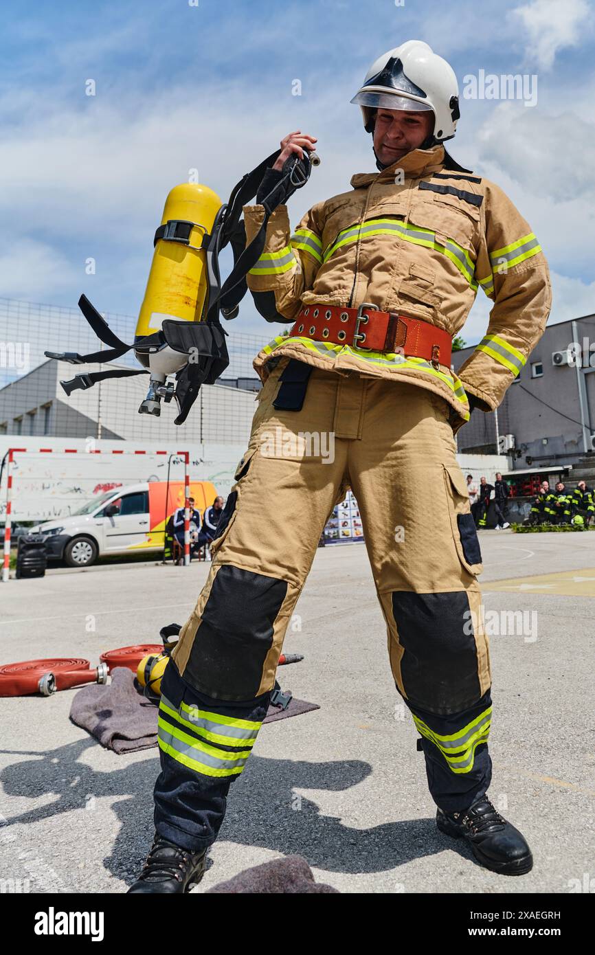 A firefighter dons the essential components of their professional gear ...