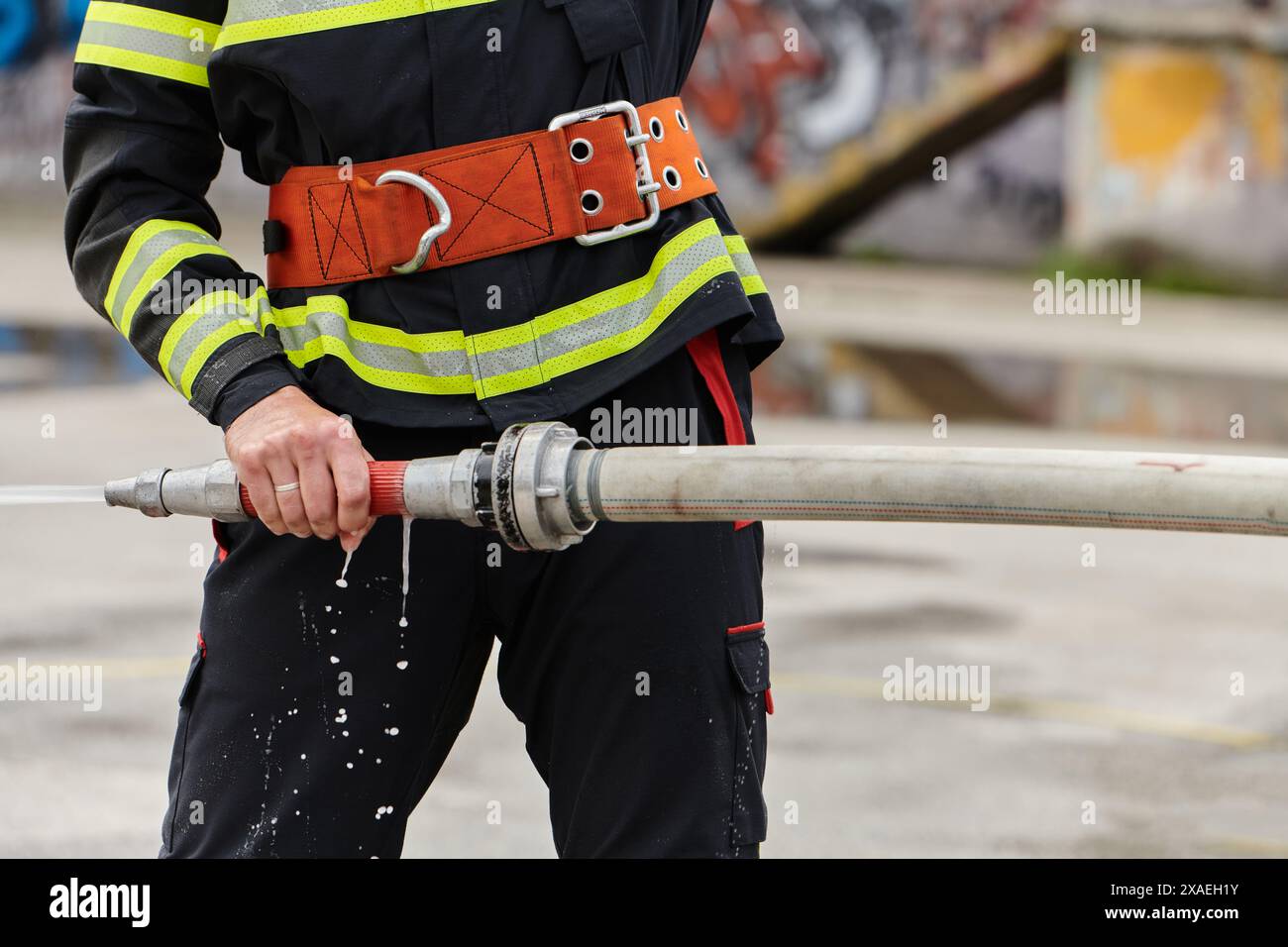 In a dynamic display of synchronized teamwork, firefighters hustle to ...