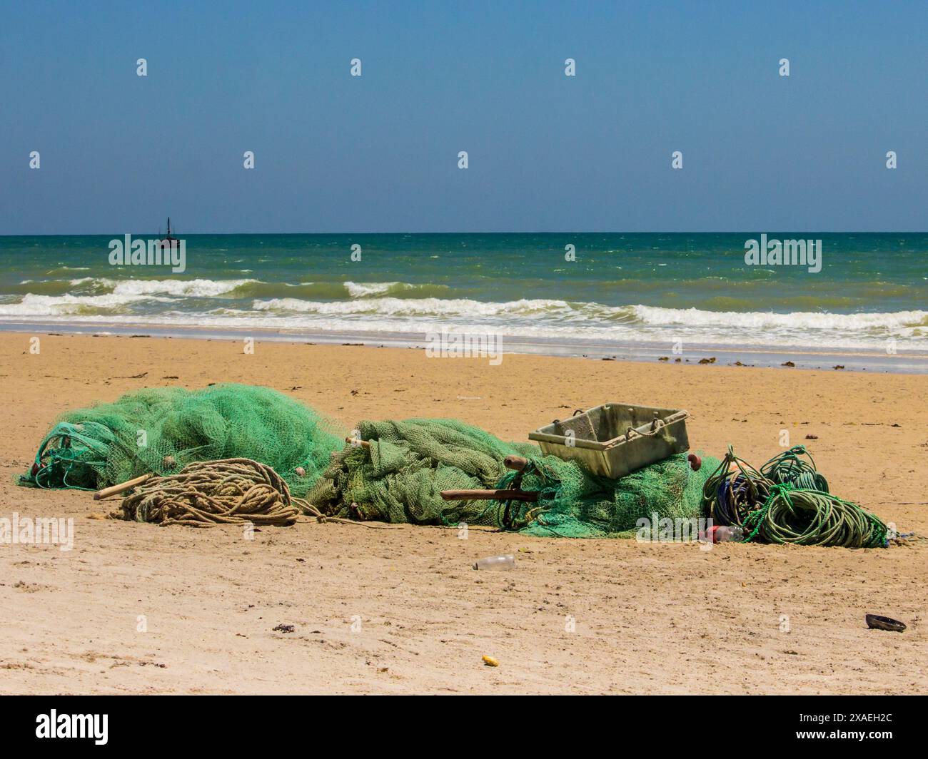 Nets and rope on the beach at the small fishing and tourist town of ...