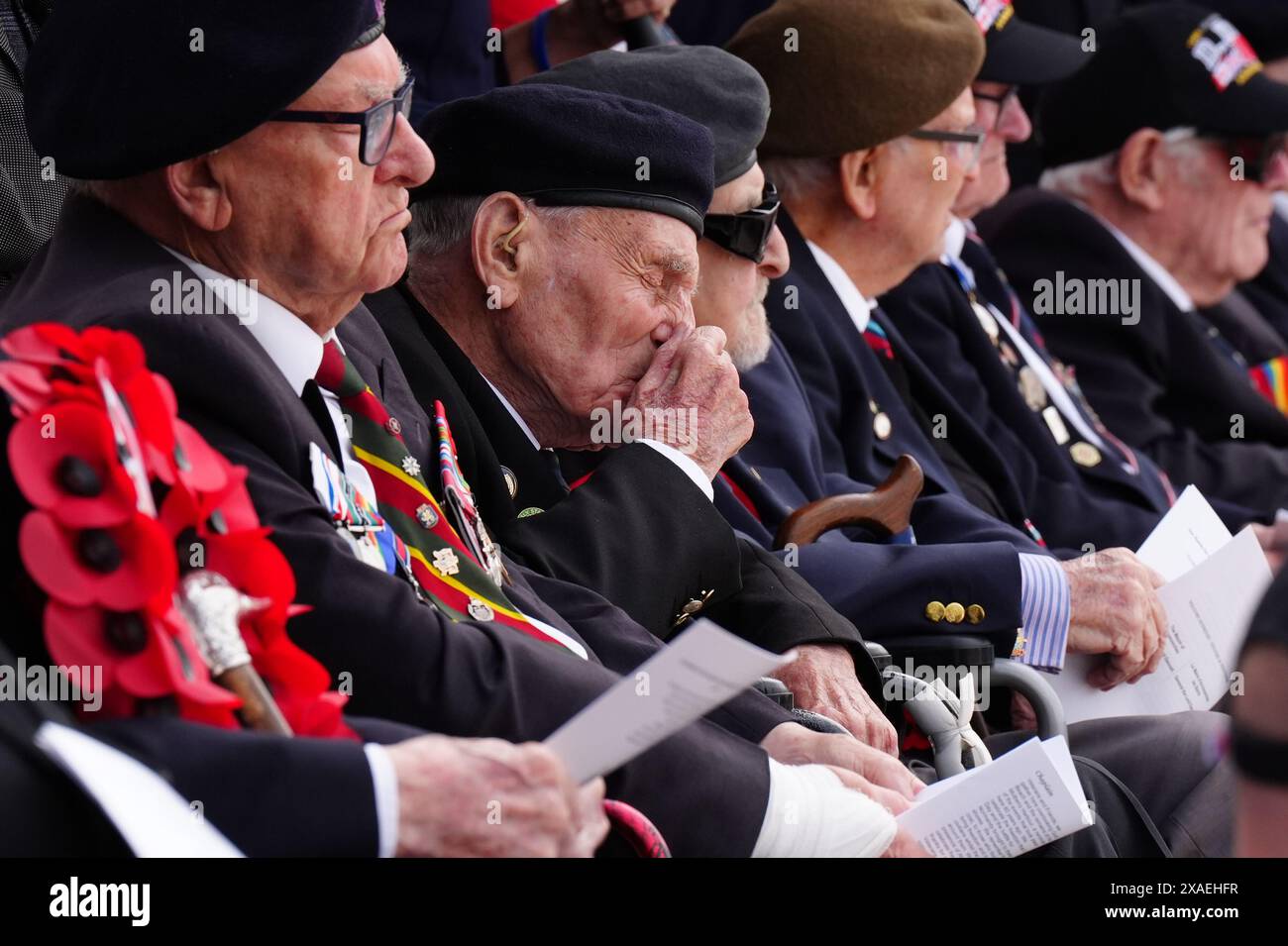 Veterans watch a parade with the Spirit of Normandy Trust, on the sea ...