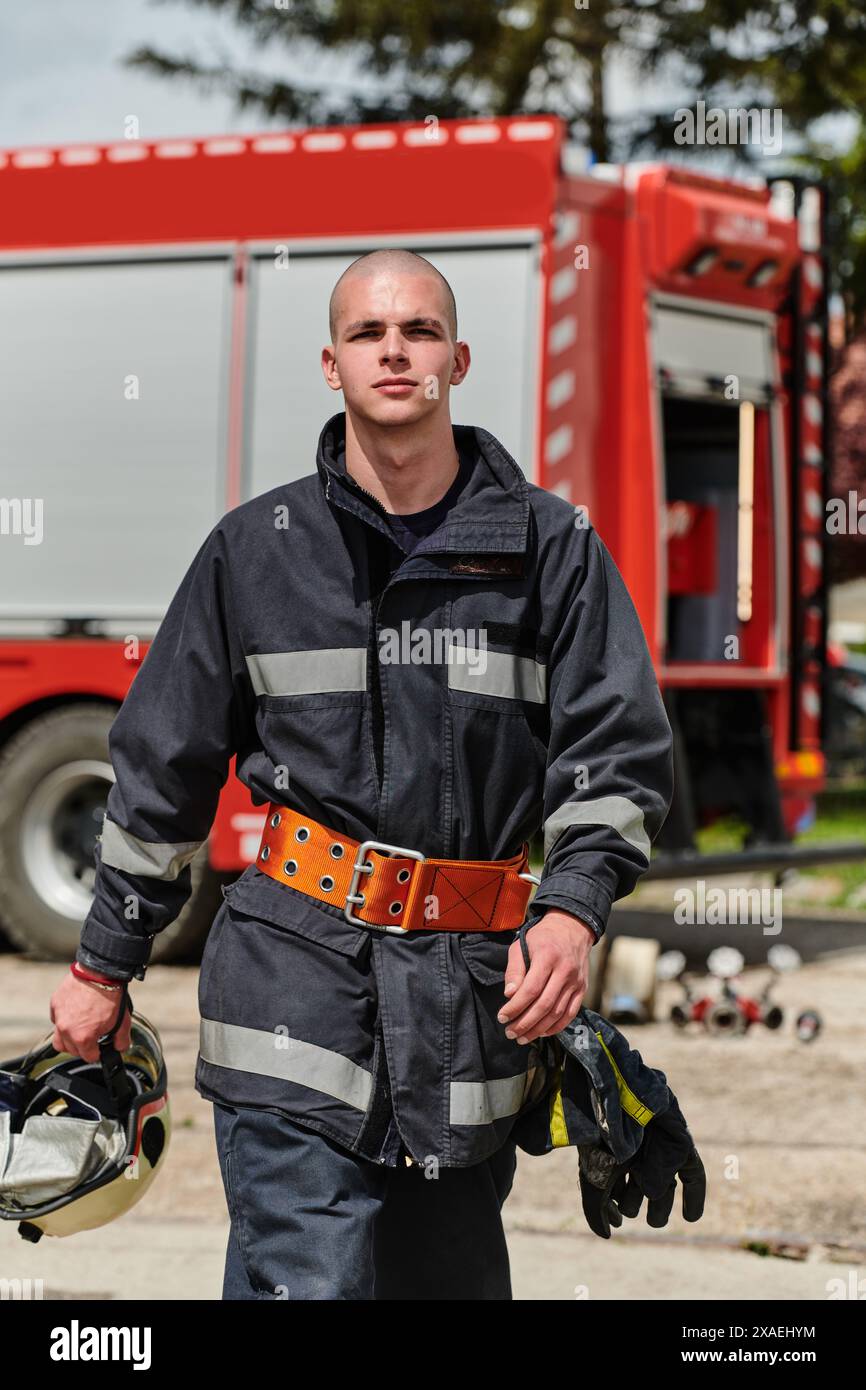 Firefighter Stands Proudly with Professional Gear Beside Fire Truck ...