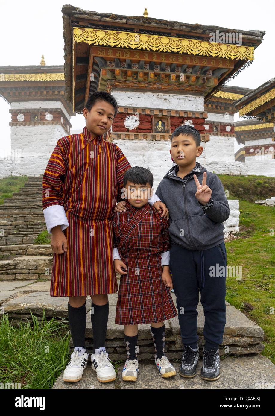 Butanese children in Dochu La with 108 stupas or chortens, Punakha ...