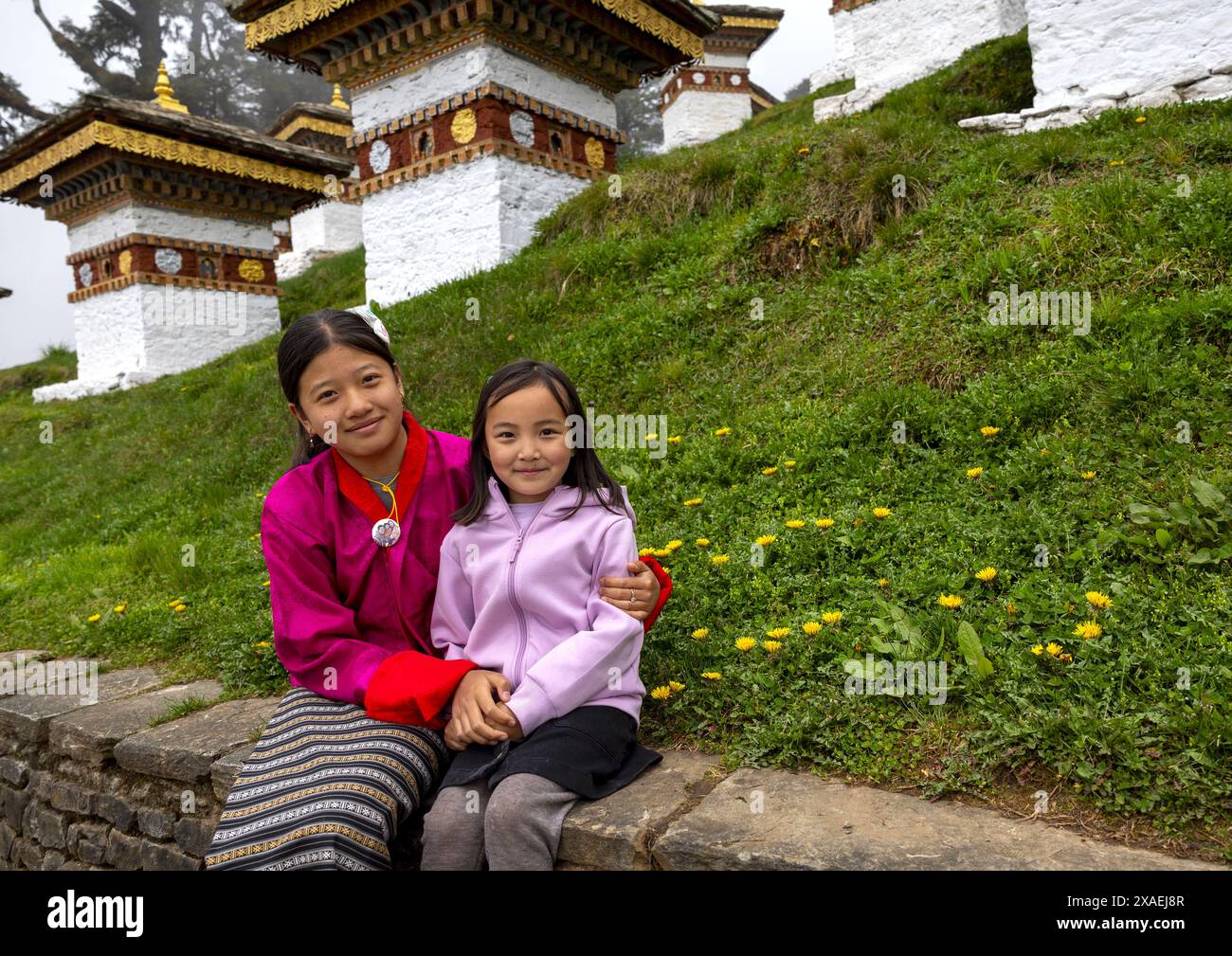 Butanese girls in Dochu La with 108 stupas or chortens, Punakha ...