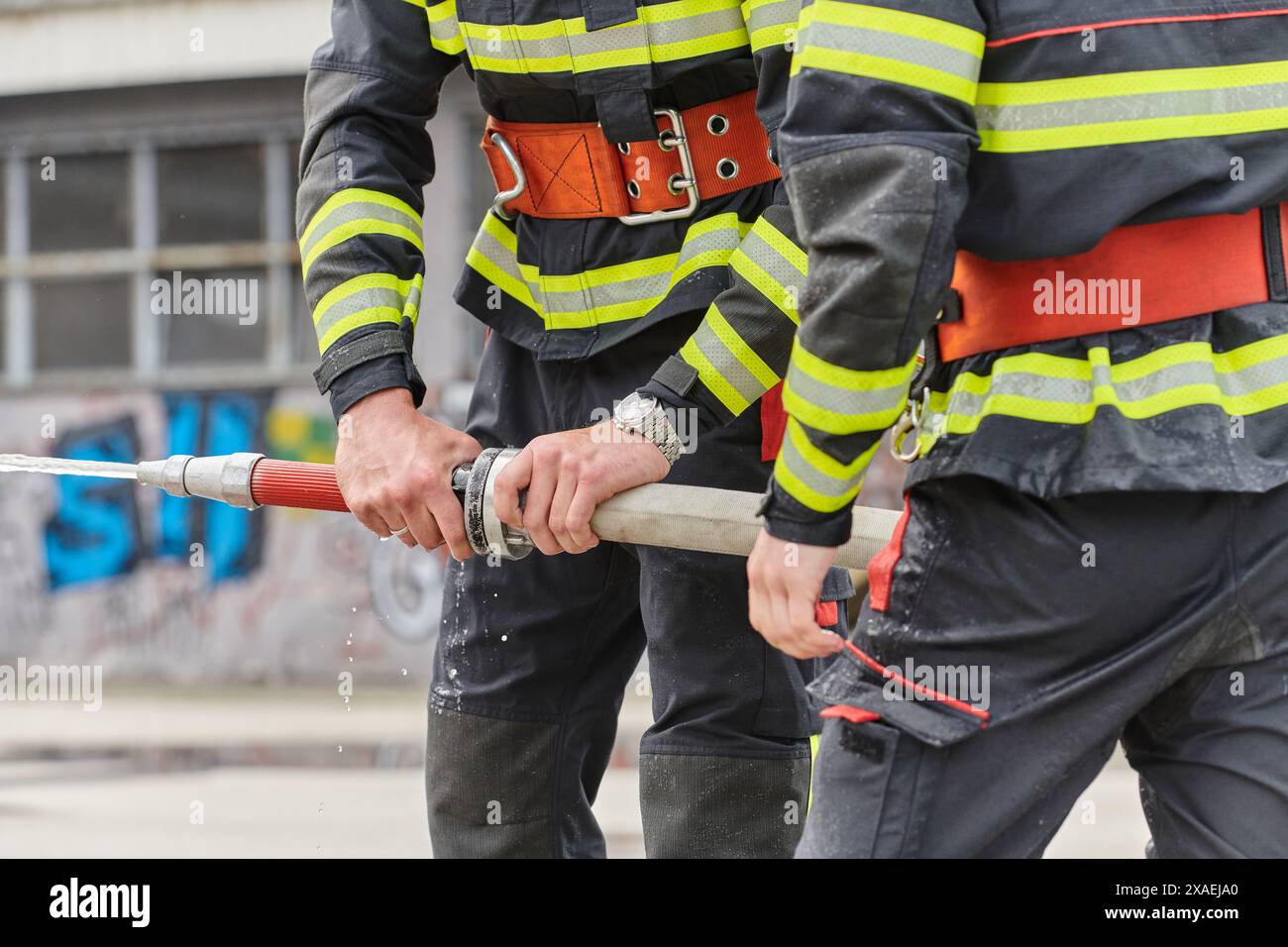 In a dynamic display of synchronized teamwork, firefighters hustle to ...