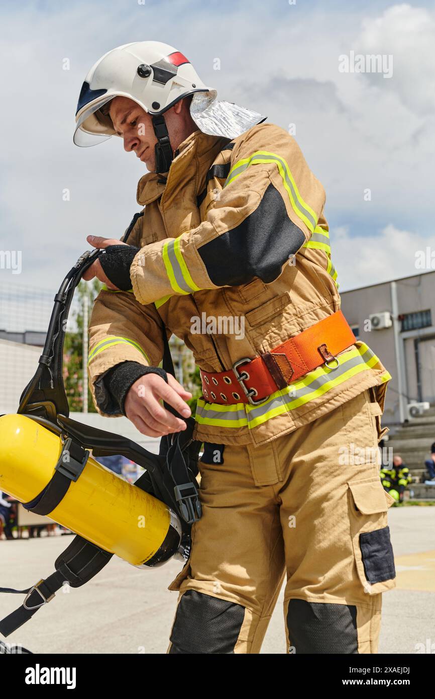 A firefighter dons the essential components of their professional gear ...