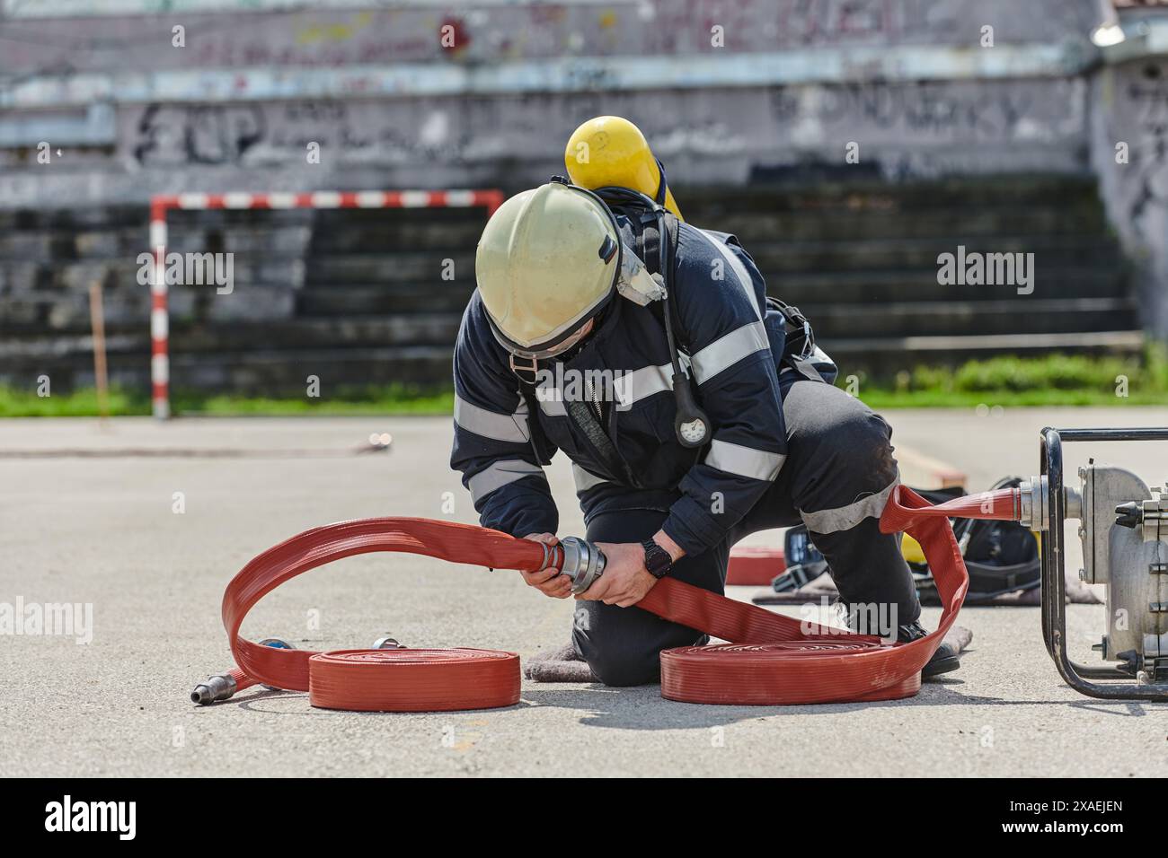 A firefighter dons the essential components of their professional gear ...