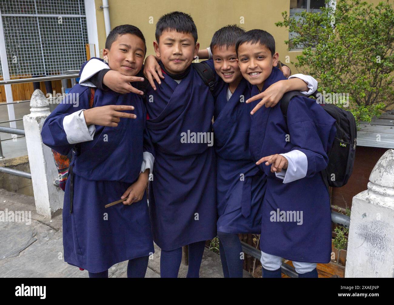 Bhutanese boys in school uniforms in the street, Chang Gewog, Thimphu ...