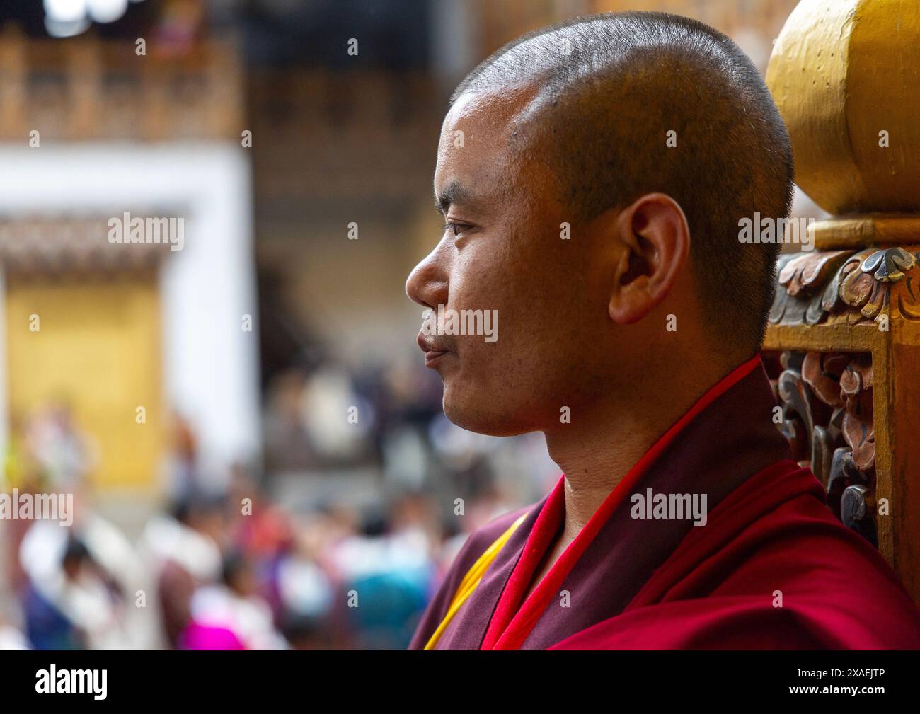 Side view portrait of a bhutanese monk in Punakha Dzong, Punakha ...