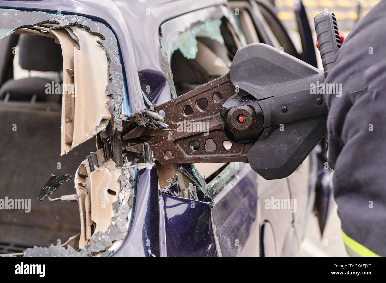 A dedicated team of professional firefighters employs specialized tools ...