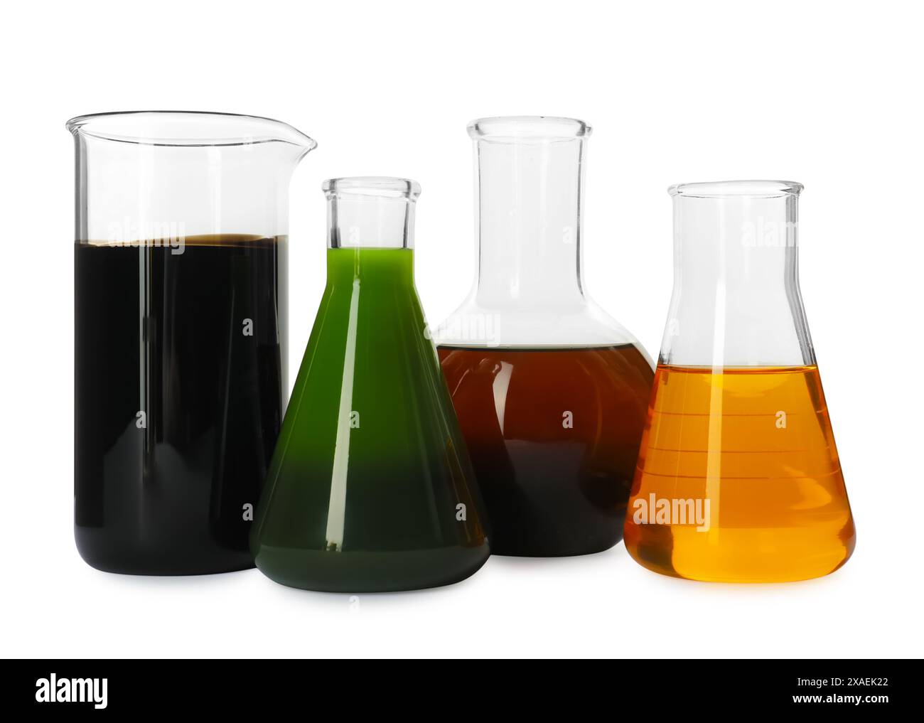 Beaker and flasks with different types of oil isolated on white Stock ...