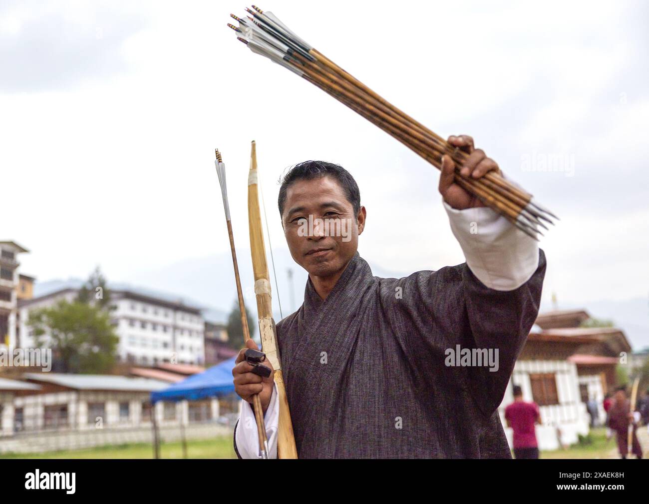 Bhutanese archer with arrows in his hands, Chang Gewog, Thimphu, Bhutan ...