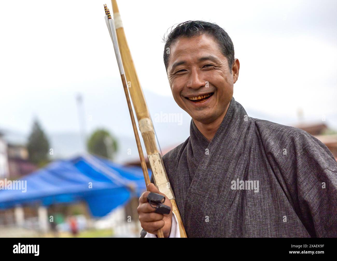 Smiling bhutanese archer with arrows in his hand, Chang Gewog, Thimphu ...