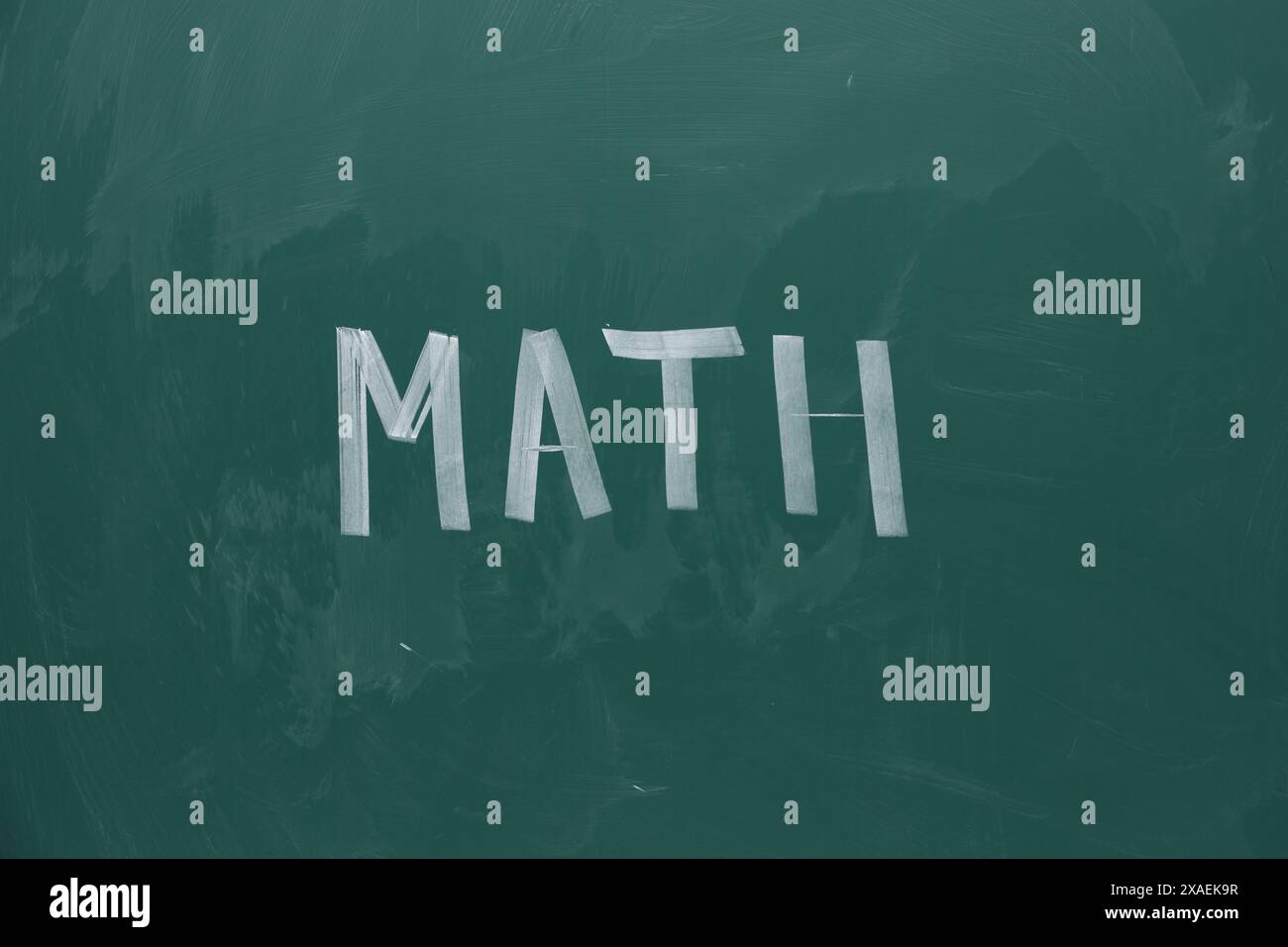 Word MATH written with chalk on green board Stock Photo - Alamy