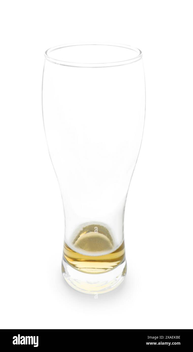 Almost empty glass of beer isolated on white Stock Photo - Alamy