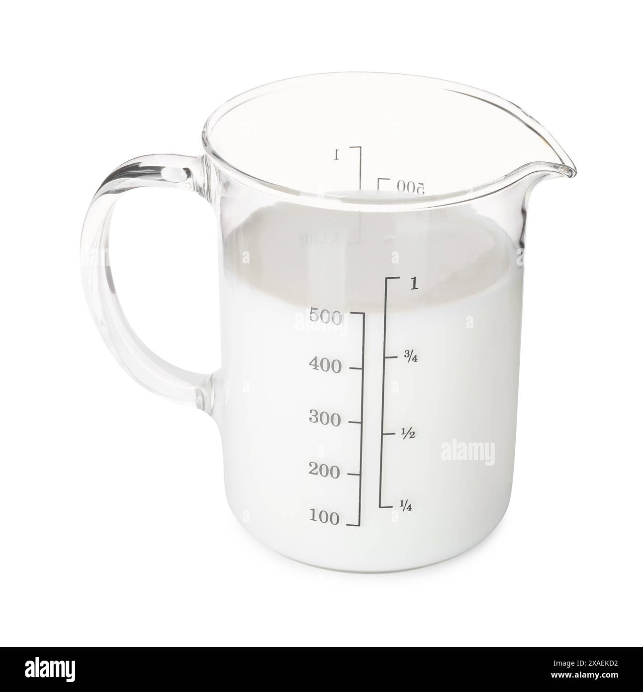 Fresh milk in measuring cup isolated on white Stock Photo - Alamy