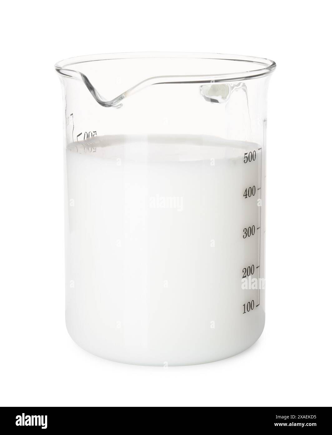 Fresh milk in measuring cup isolated on white Stock Photo - Alamy
