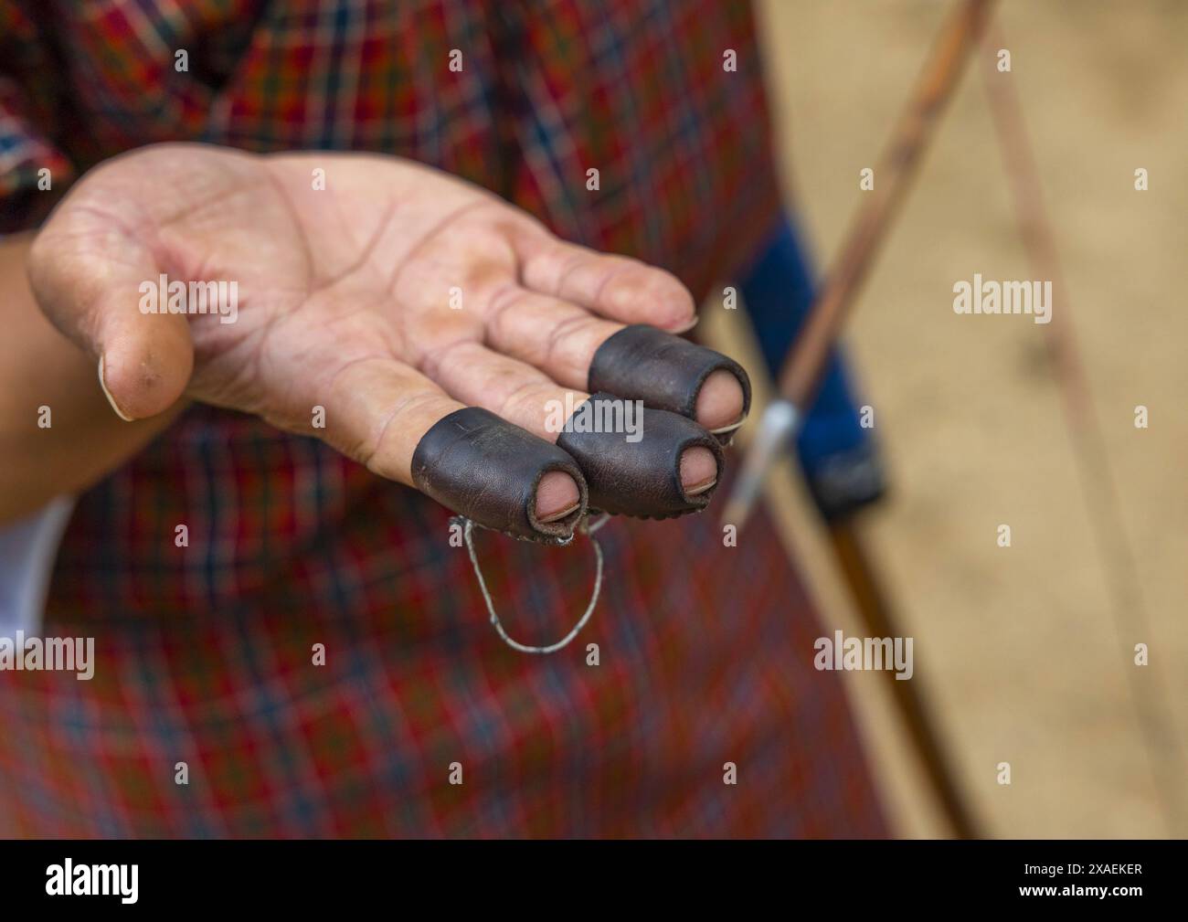 Bhutanese archer hand on an archery range, Chang Gewog, Thimphu, Bhutan ...