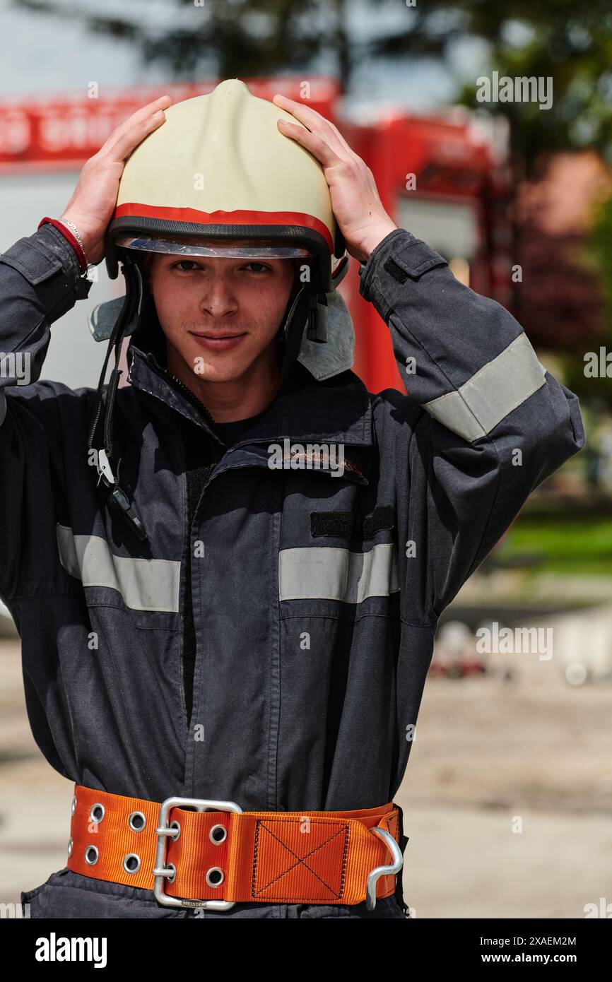 Firefighter Stands Proudly with Professional Gear Beside Fire Truck ...
