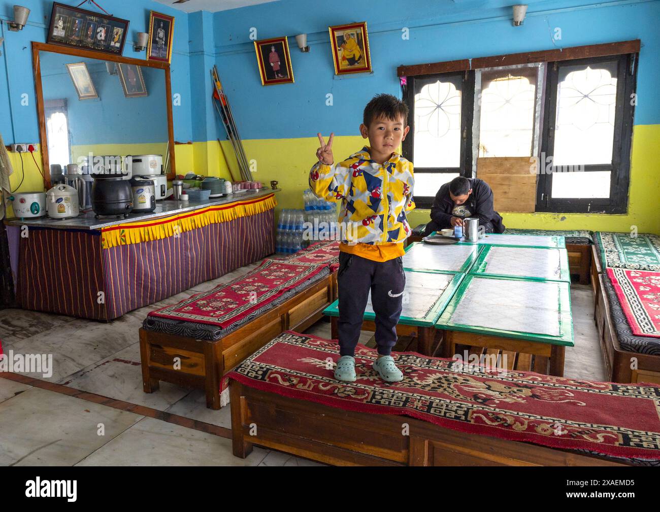 Boy in a bhutanese restaurant, Thedtsho Gewog, Wangdue Phodrang, Bhutan ...