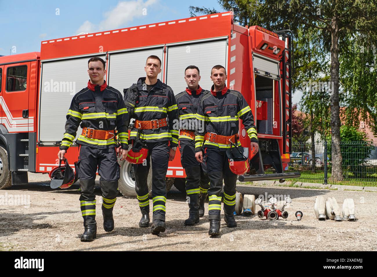 Team of Professional Firefighters Ready in Full Gear for Dangerous ...