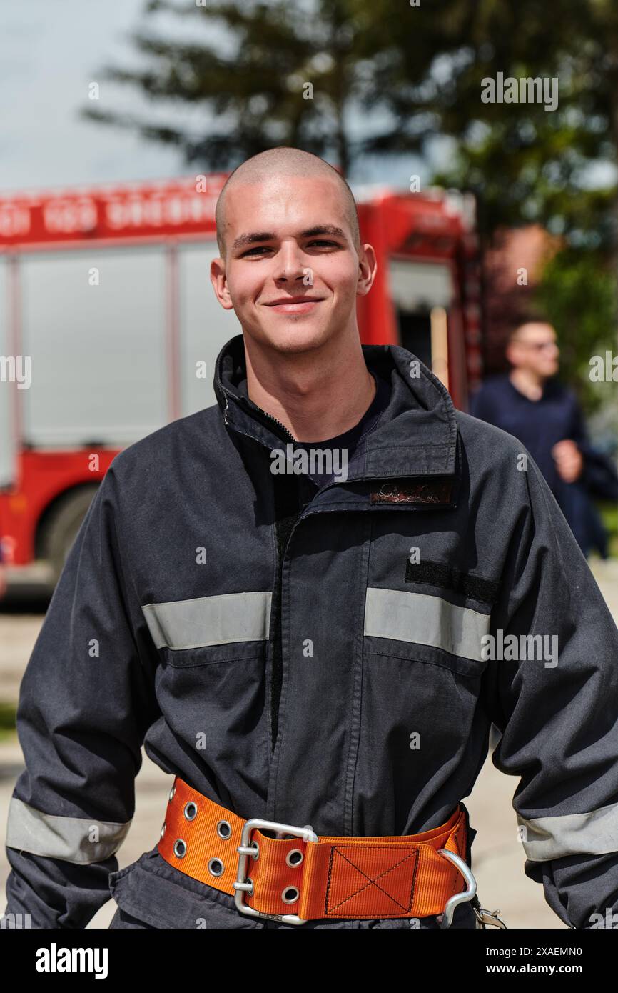 Firefighter Stands Proudly with Professional Gear Beside Fire Truck ...
