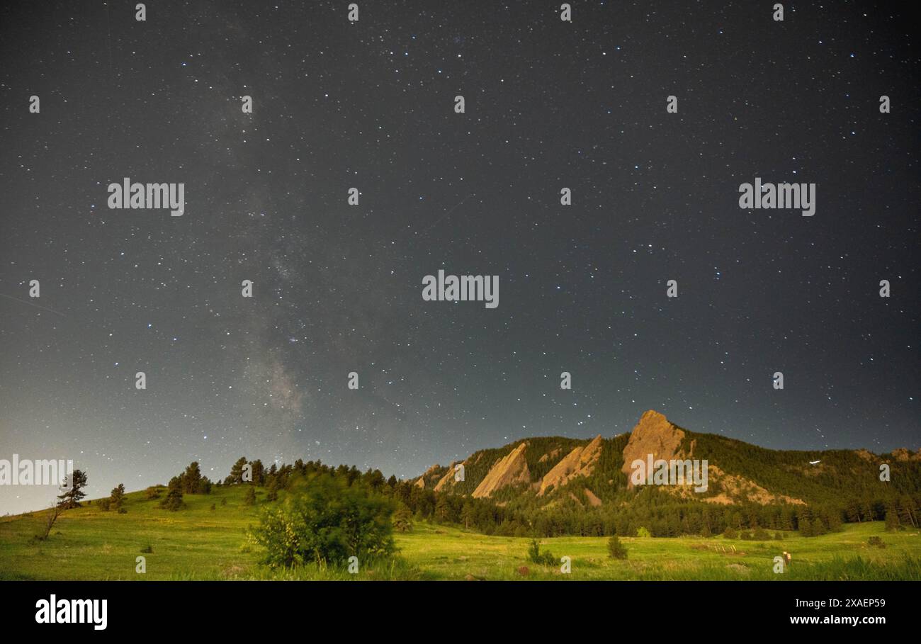 Milky Way over the beautiful mountains and blue sky at night in summer ...