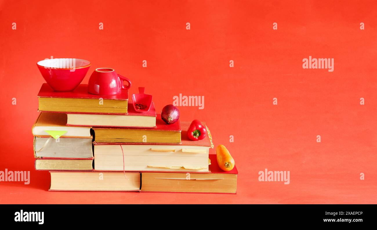 Cook books with vegetables and food ingredients, cooking,preparing food ...