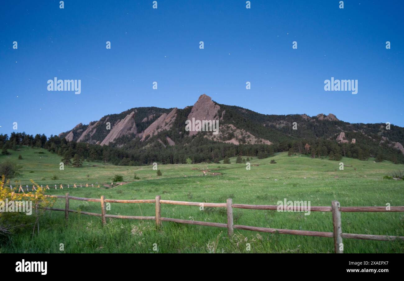 The Flatiron mountains and blue sky at night in summer. At the scenic ...