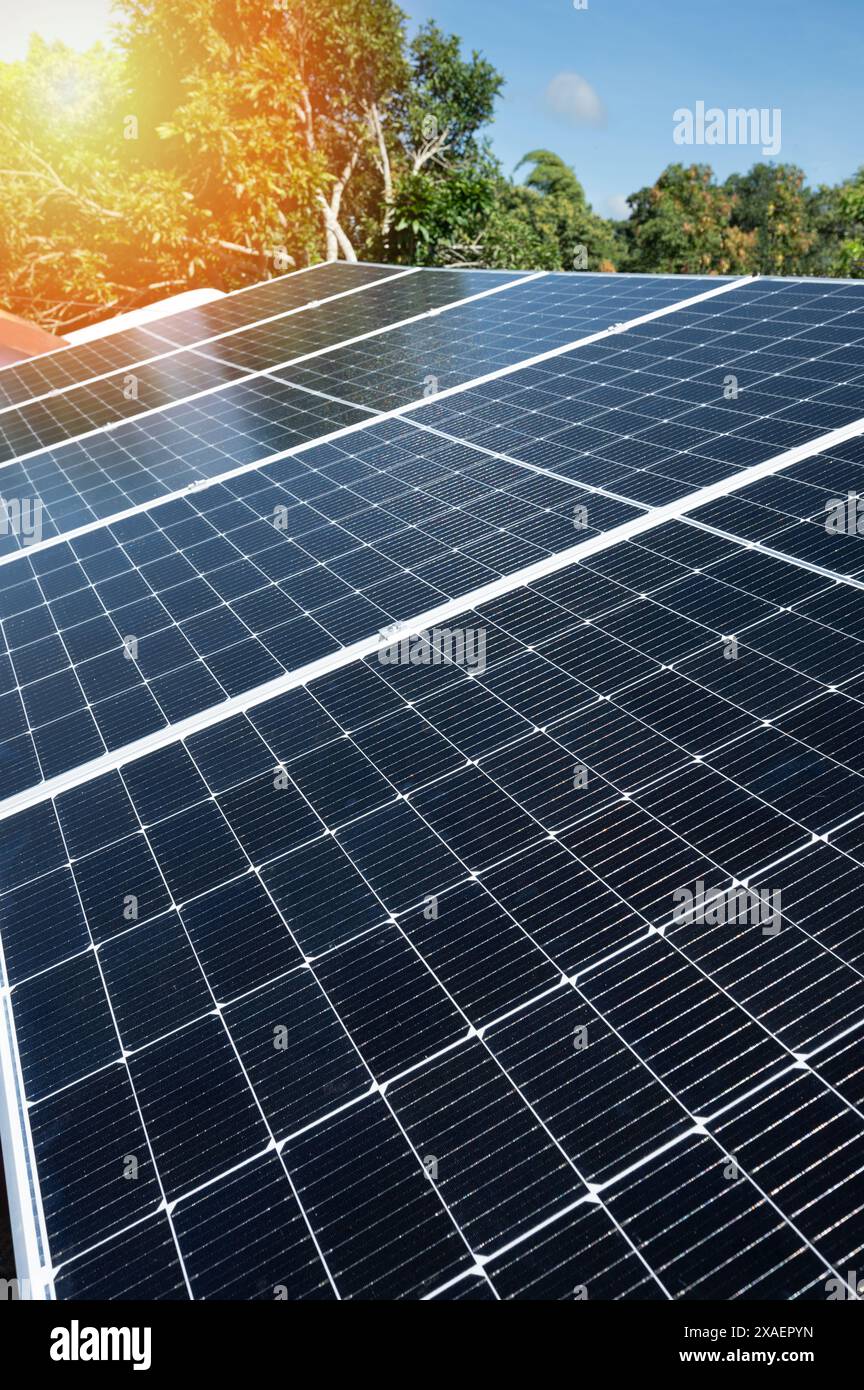 Solar panel array installation on top of house roof Stock Photo - Alamy