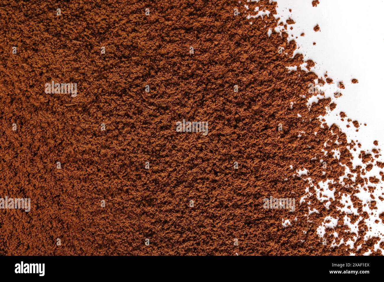Close-up view of dutch processed cocoa powder texture on white ...