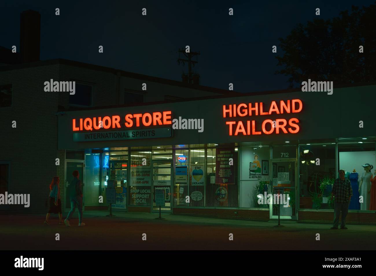 Liquor store and tailor at night, Saint Paul, Minnesota Stock Photo - Alamy