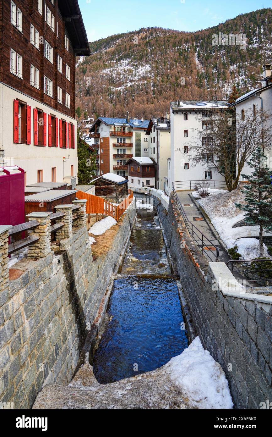 Canal of glacial melt water in the luxury car-free ski resort of ...