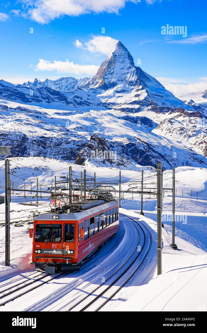 Cogwheel train of the Gornergrat Railway climbing the mountain facing ...