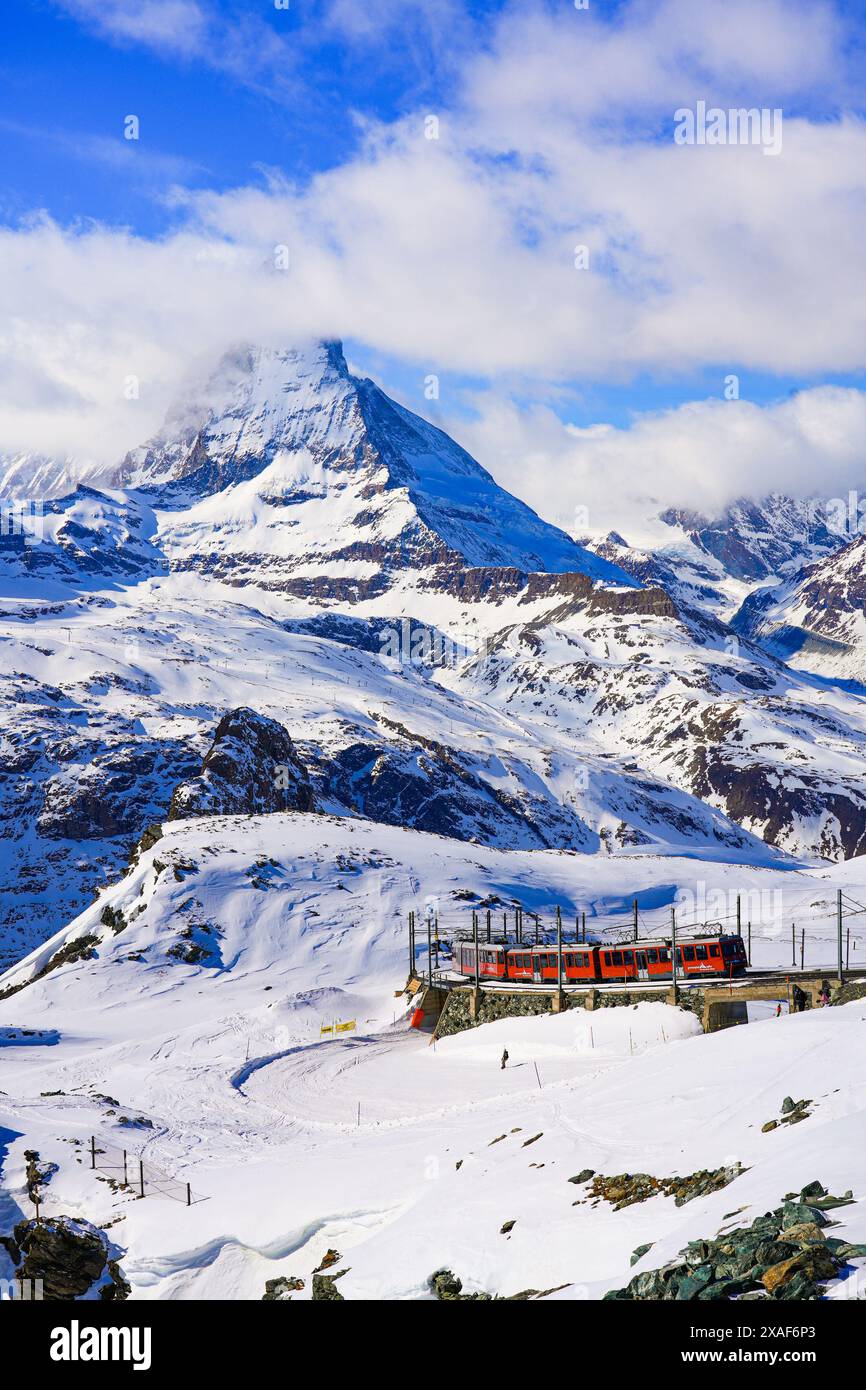 Cogwheel train of the Gornergrat Railway climbing the mountain facing ...