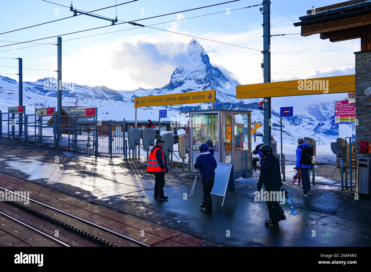 Skiers exiting the Riffelberg train station of the Gornergrat Bahn ...