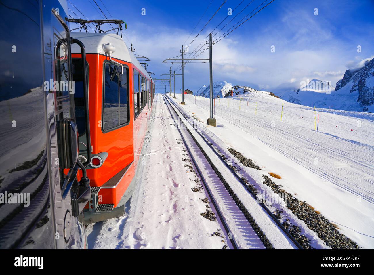 View of the snow-capped mountains from a window of the cogwheel train ...