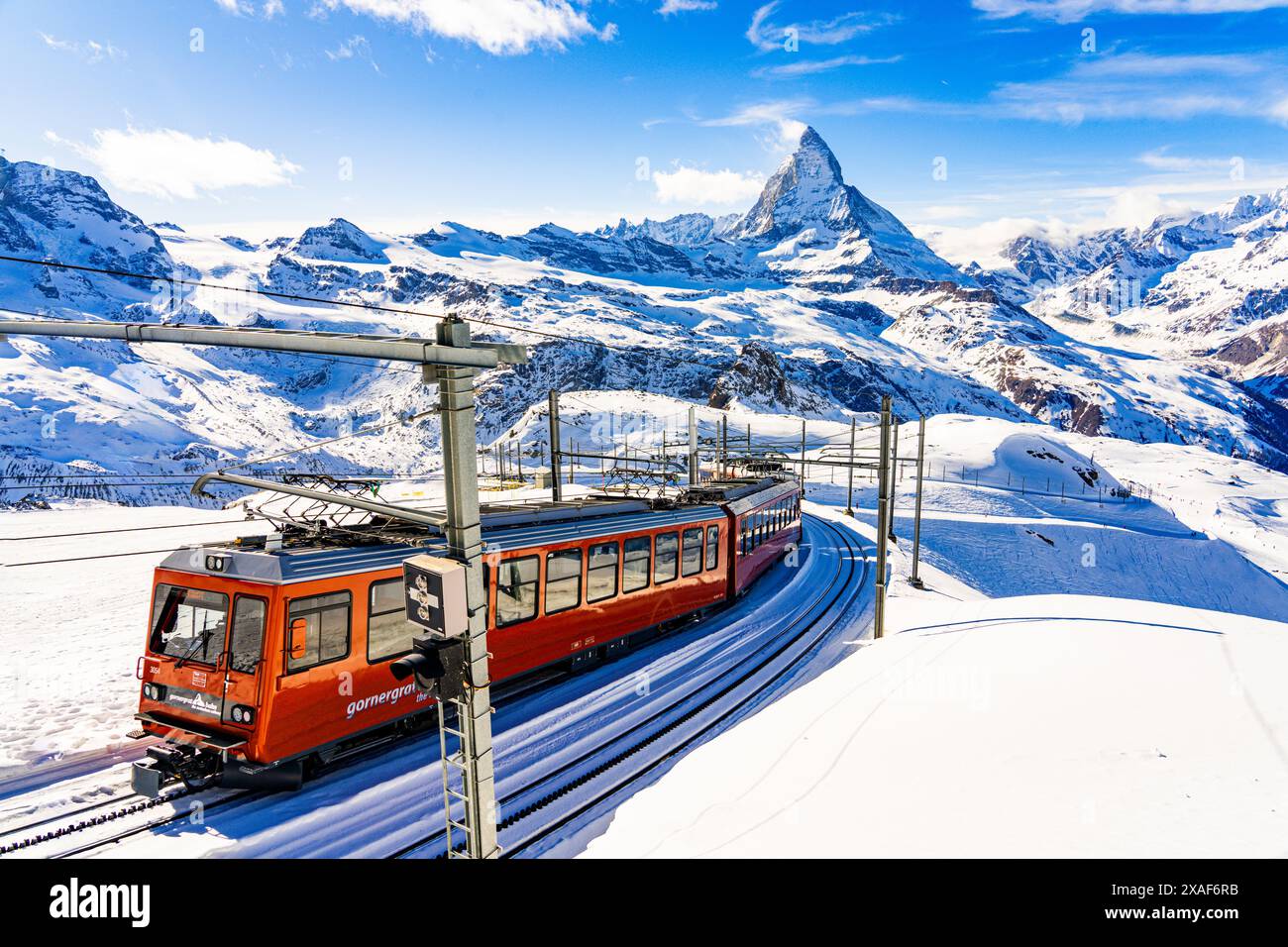 Cogwheel train of the Gornergrat Railway climbing the mountain facing ...
