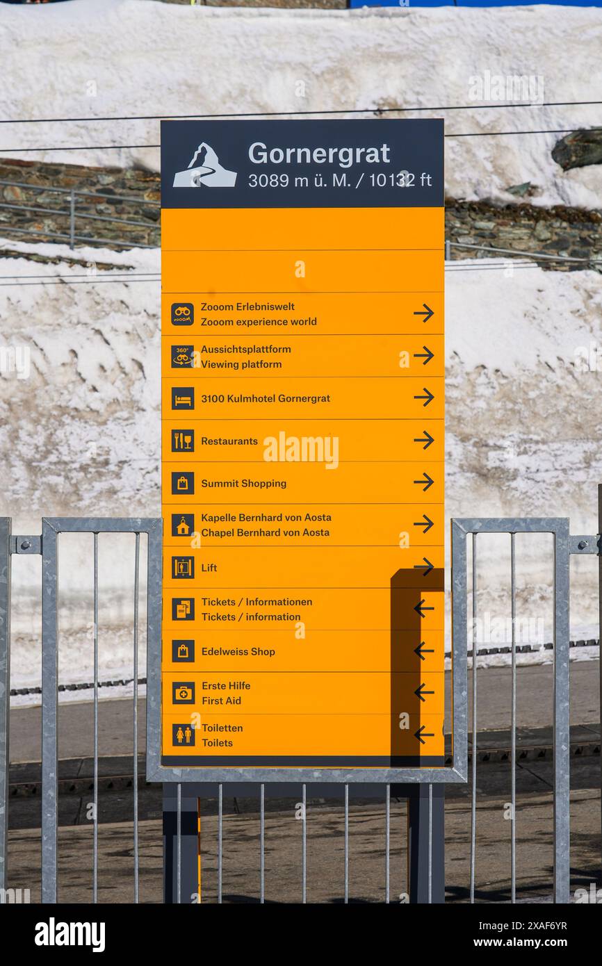 Yellow directional sign pointing at the tourist facilities of the ...