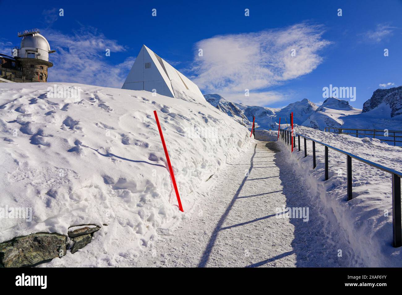 Snow-covered pathway near the Gornergrat Observatory housed in the ...