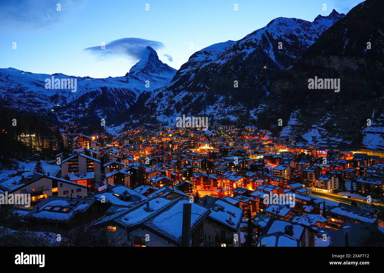 Winter aerial view of the village of Zermatt at night, overlooked by ...