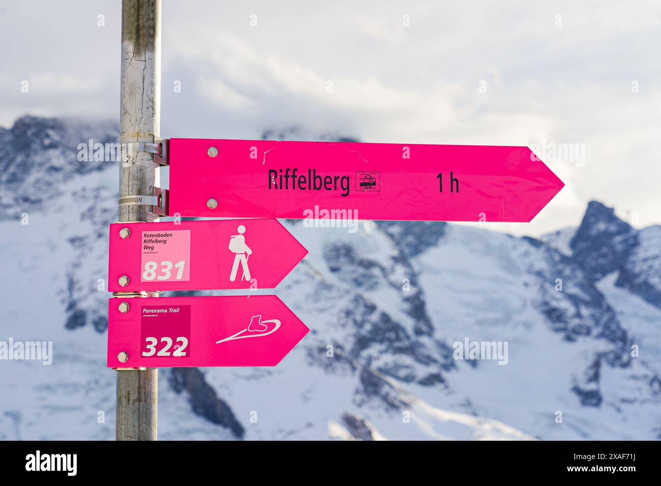 Directional sign pointing at the Riffelberg train station in the ...