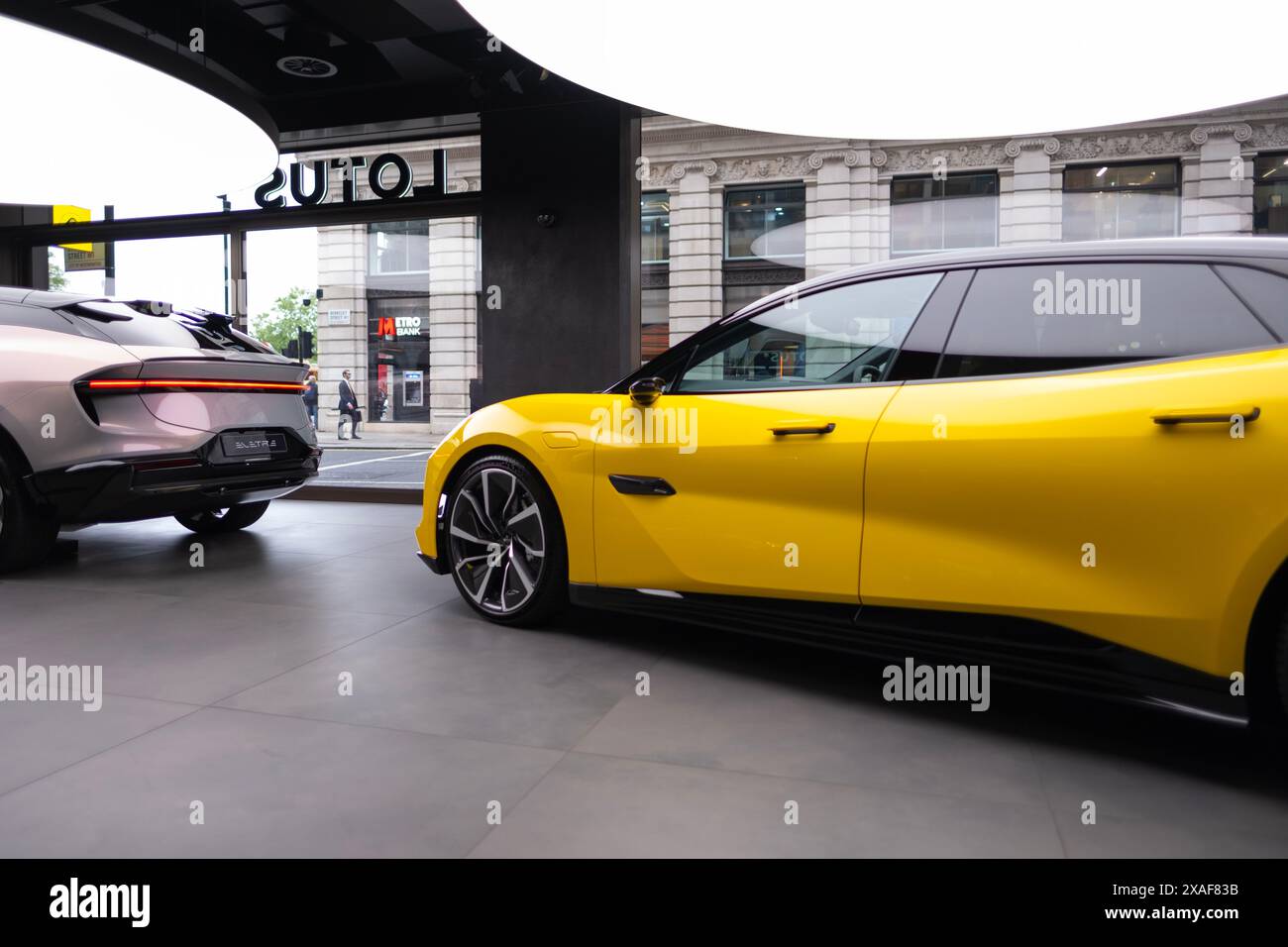 new yellow battery-Electric Hyper-GT Lotus Emeya in showroom, British ...