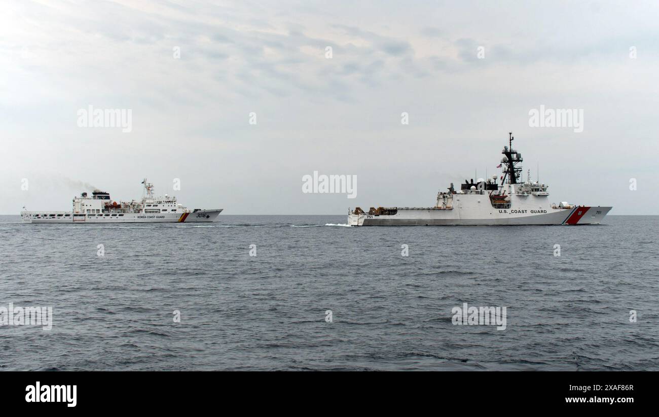 Korea Coast Guard's patrol vessel Taepyongyang 16(L) and U.S. Coast ...