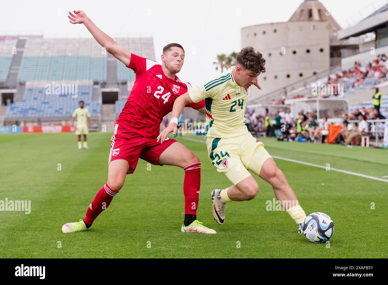 ALGARVE, PORTUGAL - 06 JUNE 2024: Wales' Lewis Koumas and Gibraltar's ...