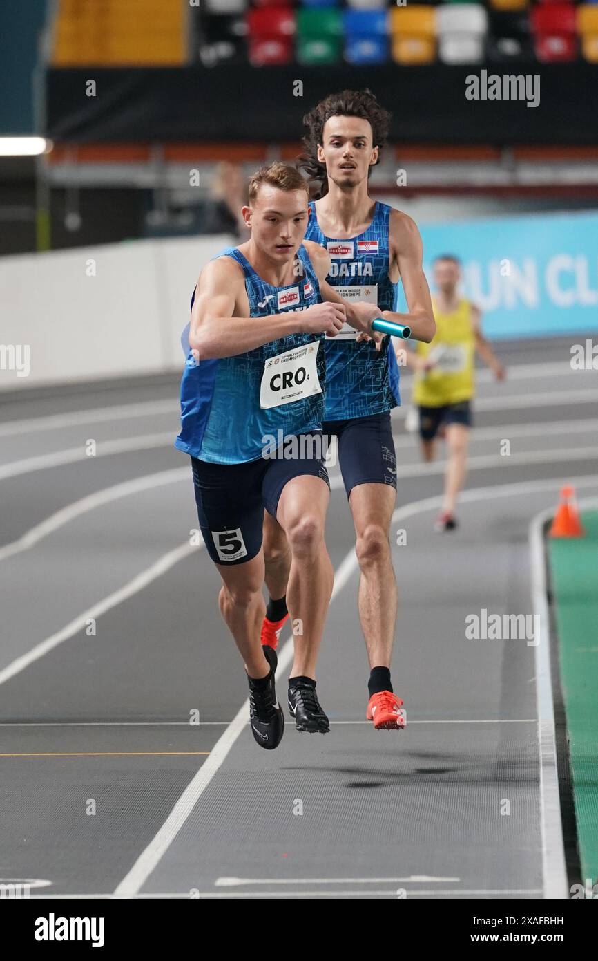 ISTANBUL, TURKIYE - FEBRUARY 10, 2024: Athletes running 4x400 metres ...