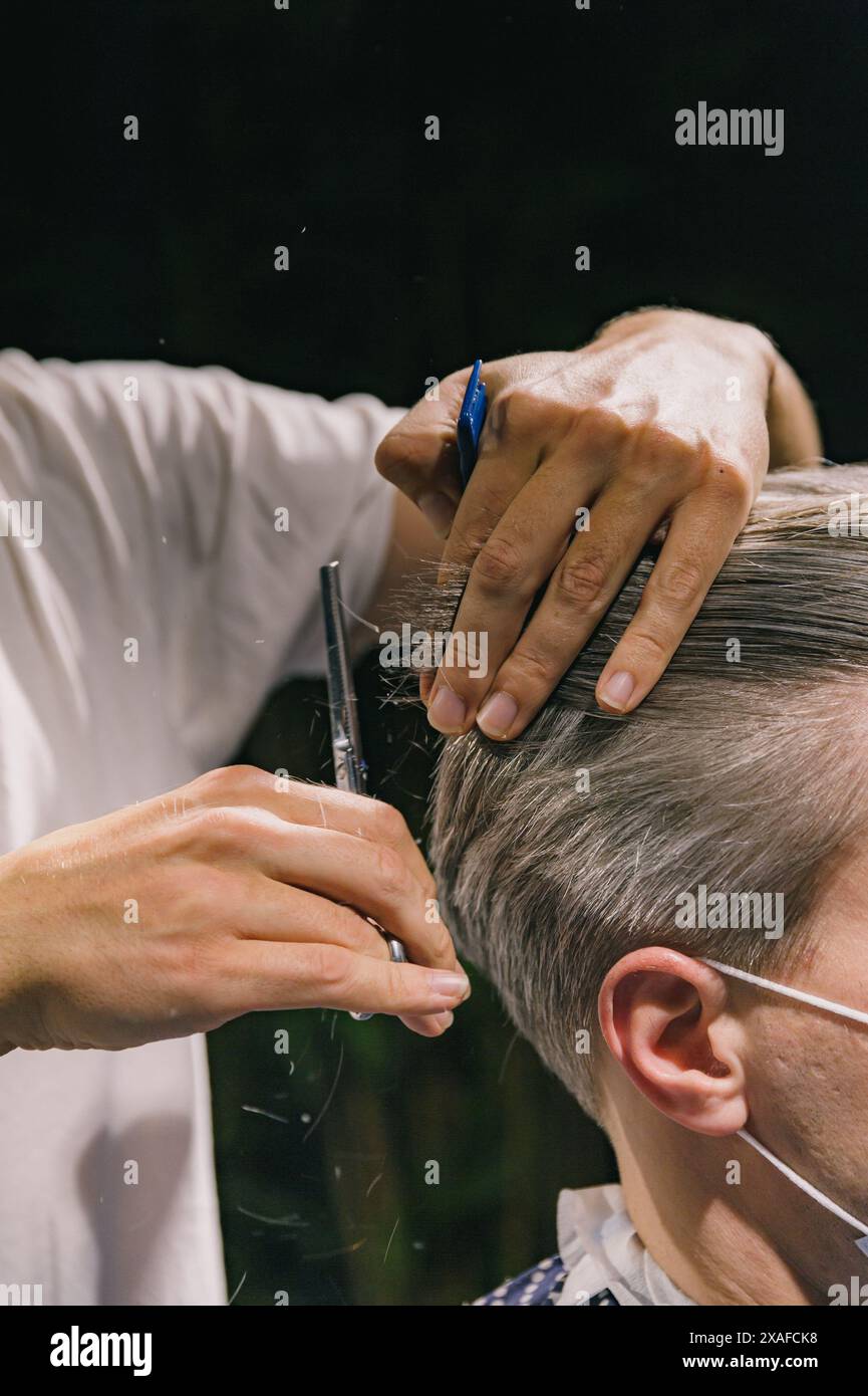 Barbershop. Barber working process with clients. Beard and hair trimming Stock Photo - Alamy