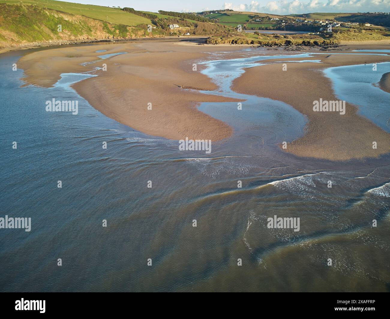 An aerial view over sandbanks in the mouth of the River Avon, seen at ...